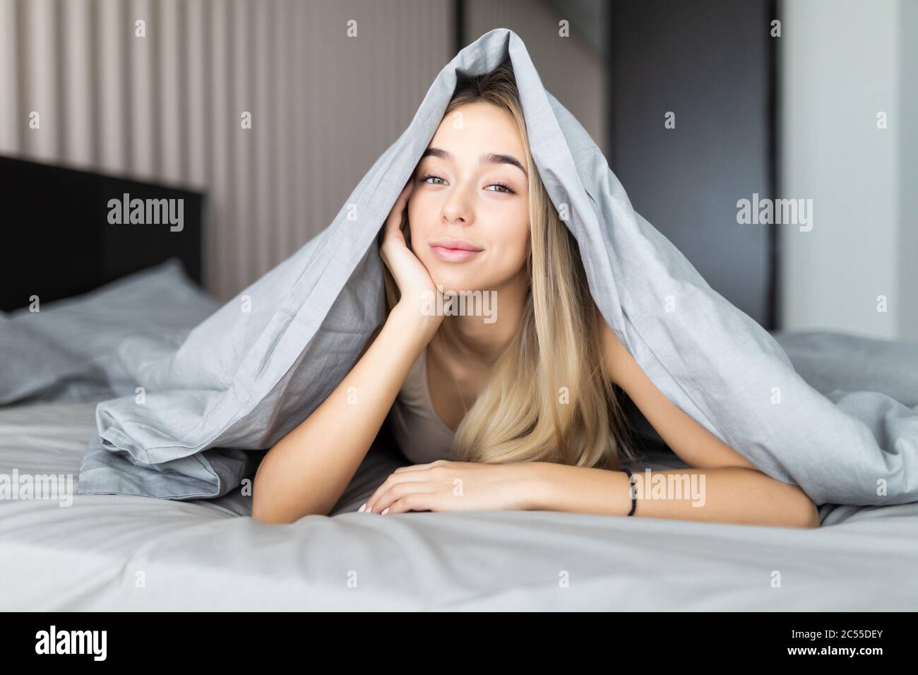 Young woman wrapped in sheet hi-res stock photography and images - Alamy