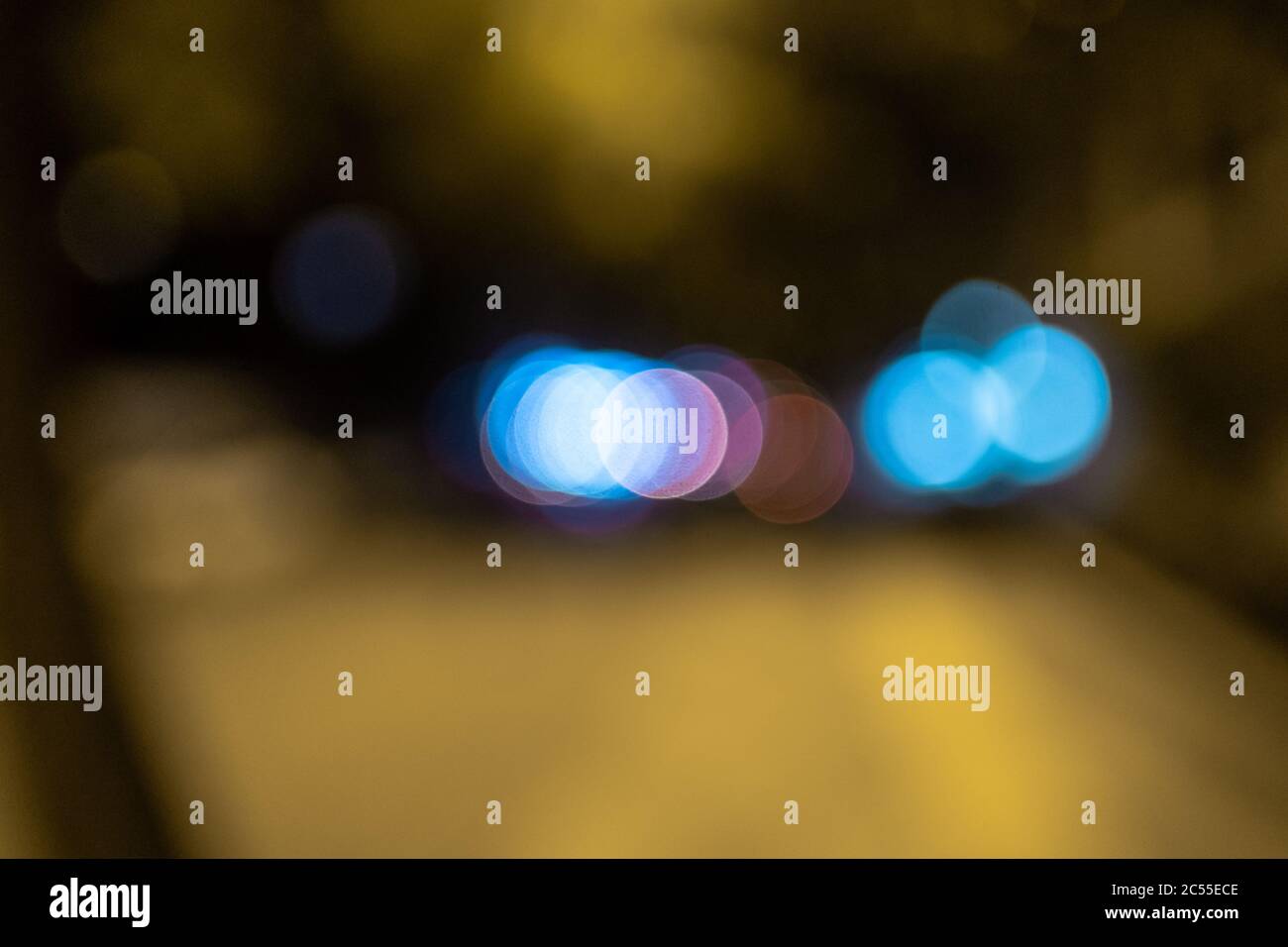 Blurred shot of some street lights glowing at night - perfect for ...