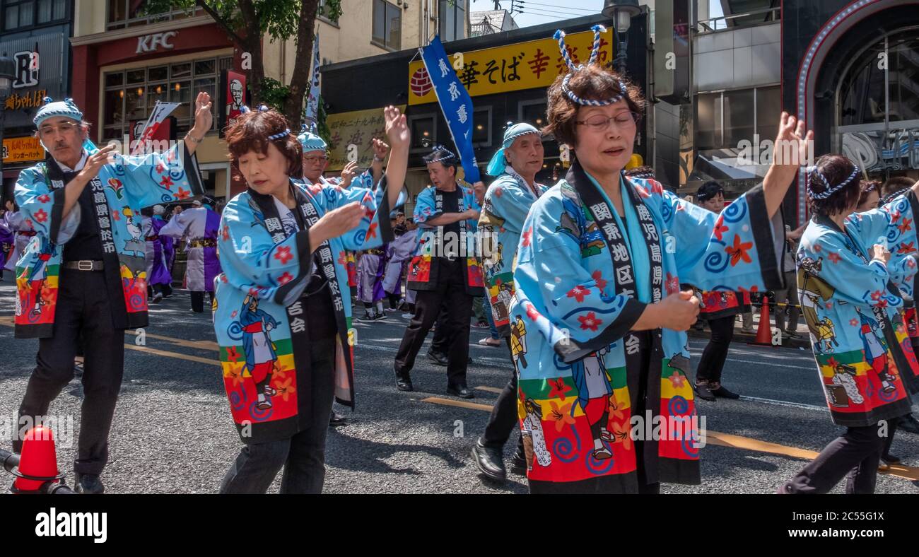 Folk dancers in colorful yukata dancing in Shibuya Kagoshima Ohara ...