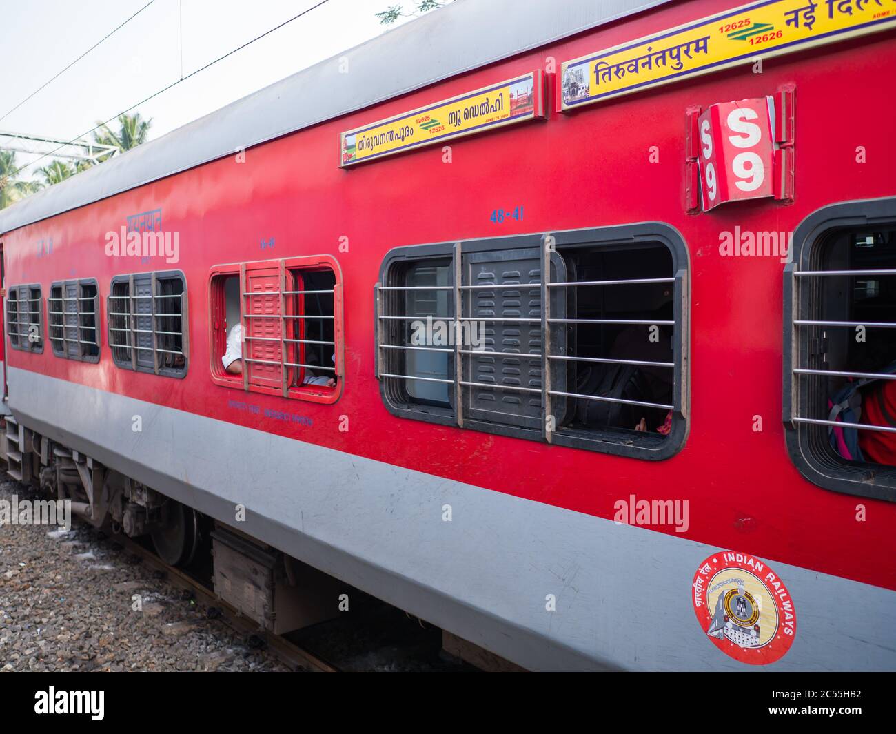 A red wagon of a traditional train in India Stock Photo - Alamy