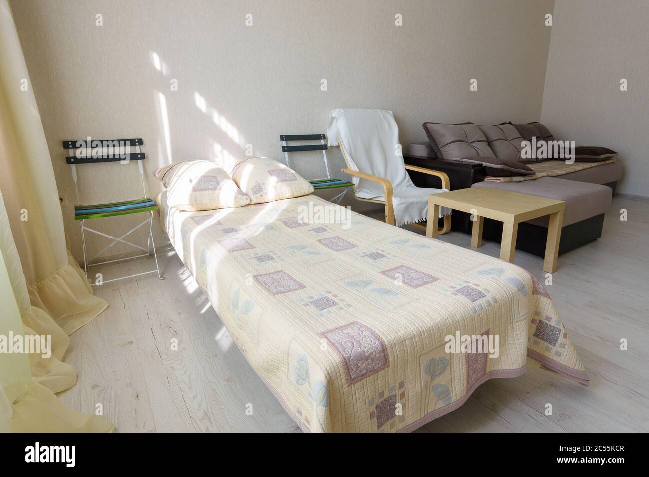 Close-up bed in a bedroom interior of a studio apartment Stock Photo ...