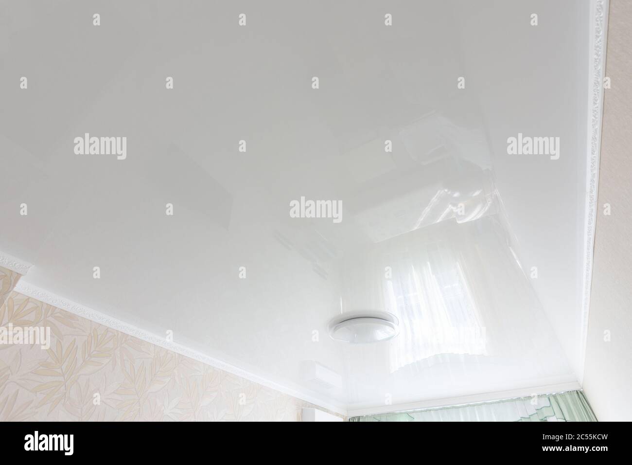 Glossy white ceiling in the interior of the bedroom Stock Photo - Alamy