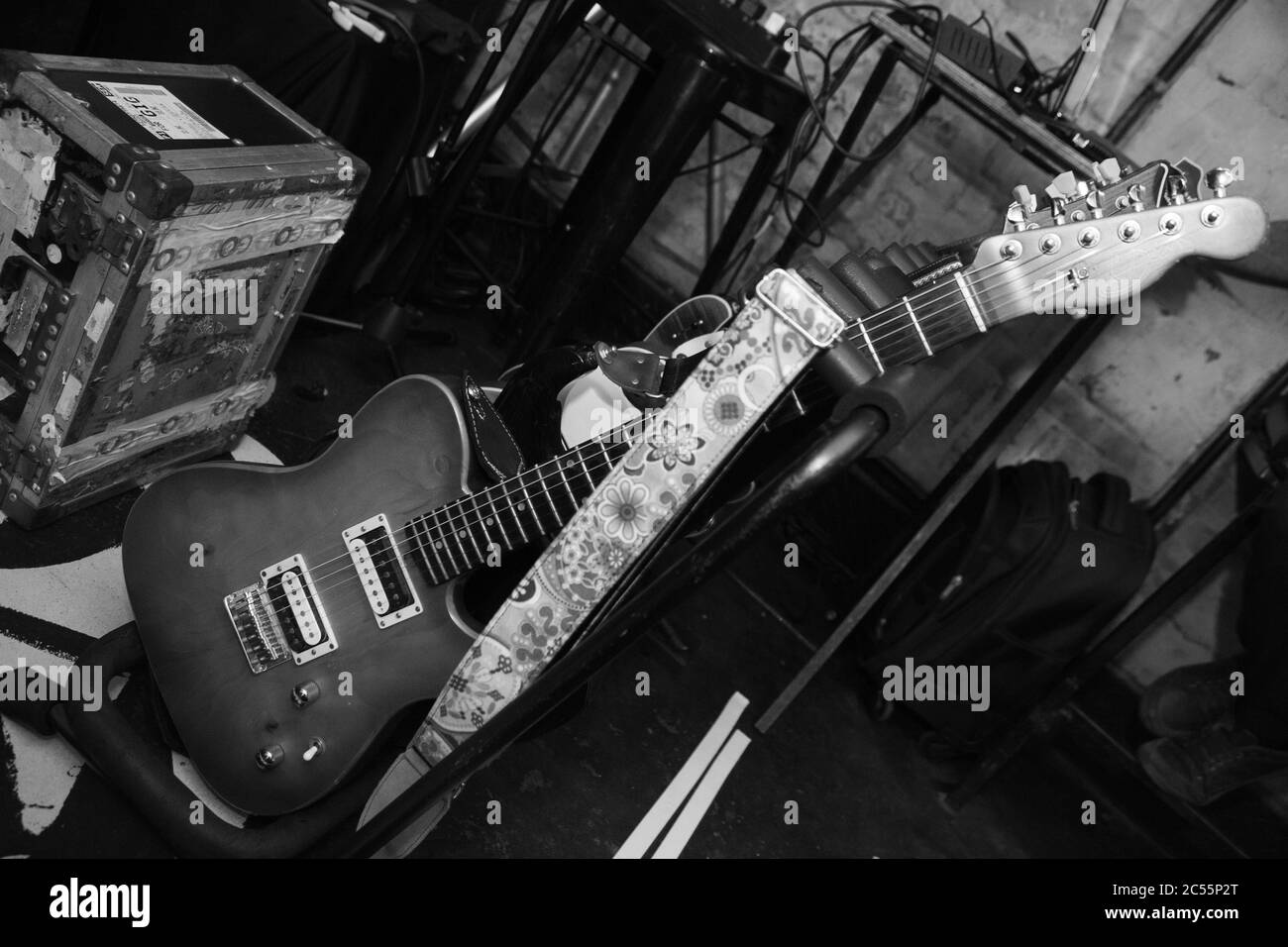 Grayscale shot of an electric guitar on the stage Stock Photo - Alamy