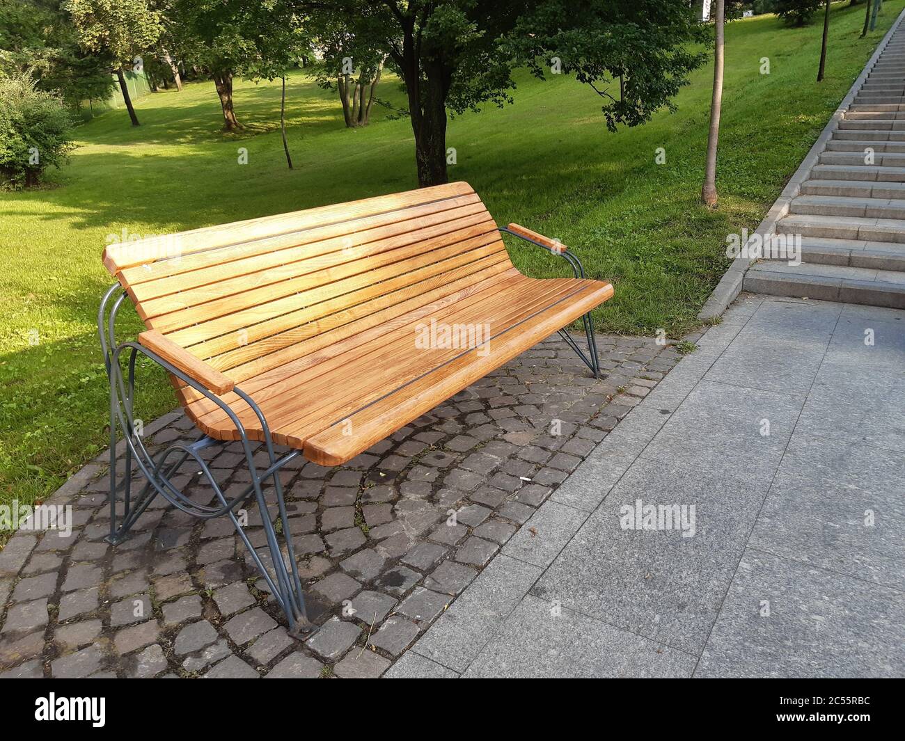 Wooden bench at the park during daytime Stock Photo - Alamy