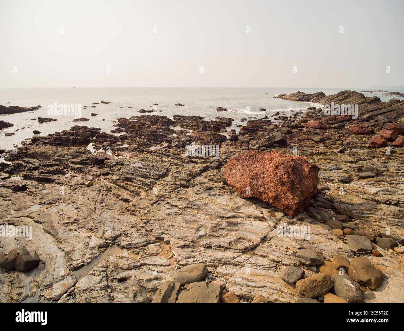 Aerial view rocks and stones on the Arambol beach in North Goa, India ...