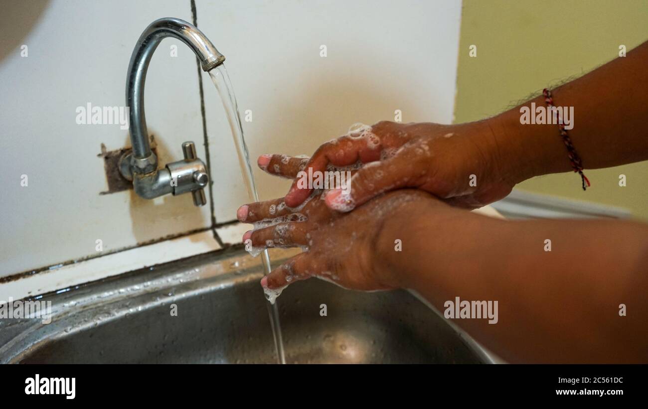 People are washing their hands with soap Stock Photo - Alamy