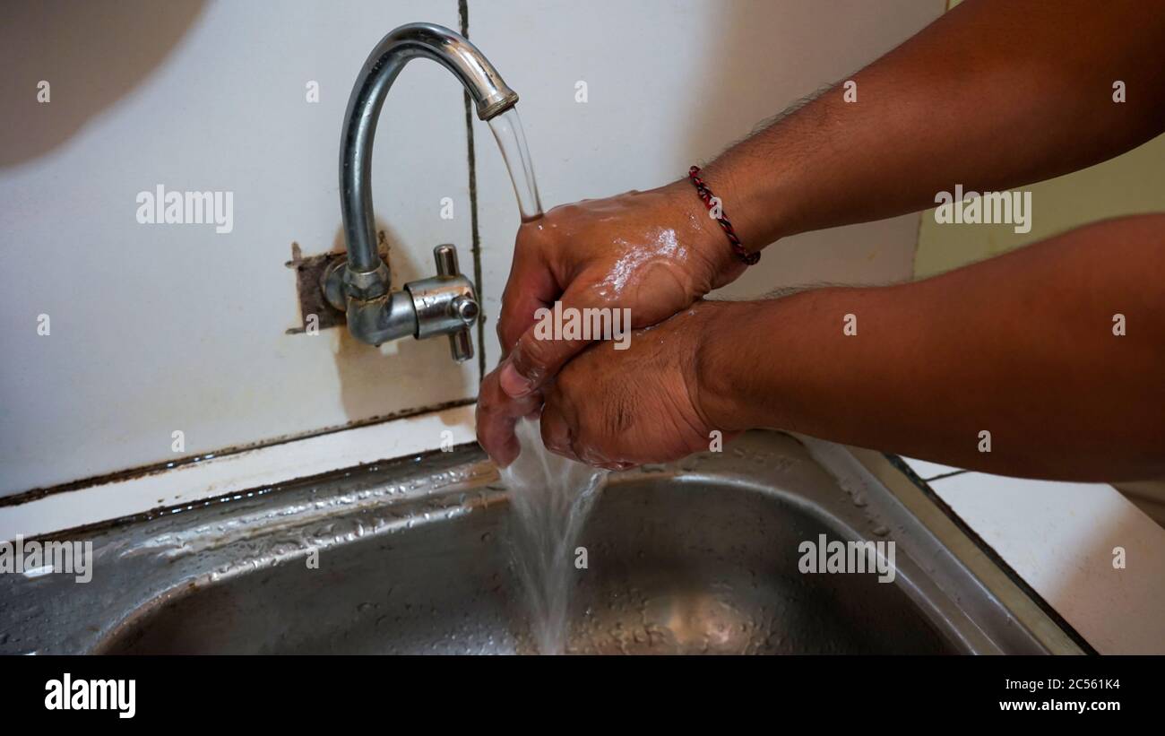 People are washing their hands with soap Stock Photo - Alamy