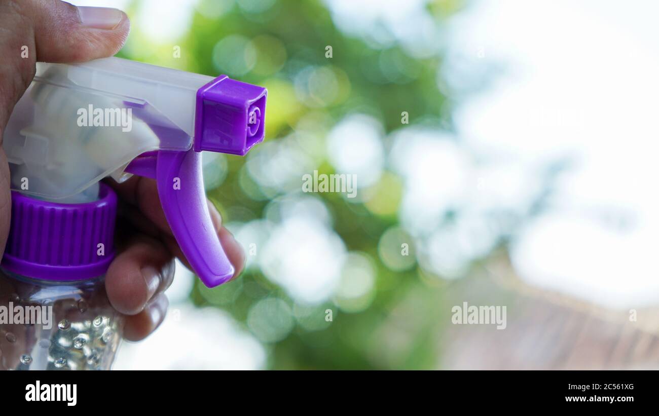 Hand holding disinfection spray hi-res stock photography and images - Alamy