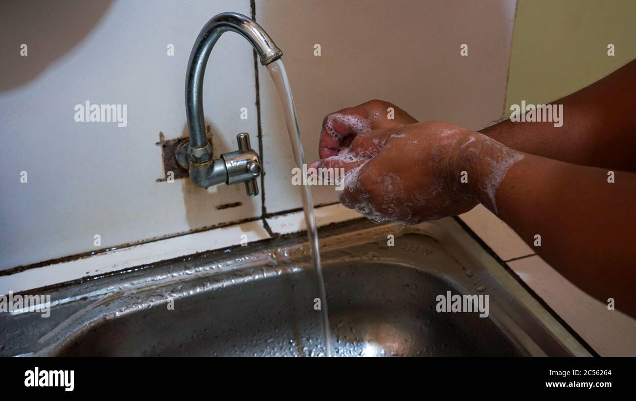 People are washing their hands with soap Stock Photo - Alamy