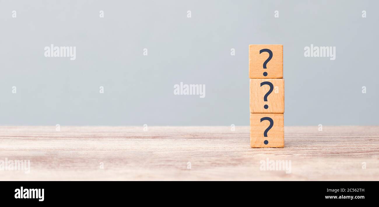 Question marks on the table written in a row on cubes. Frequently asked ...