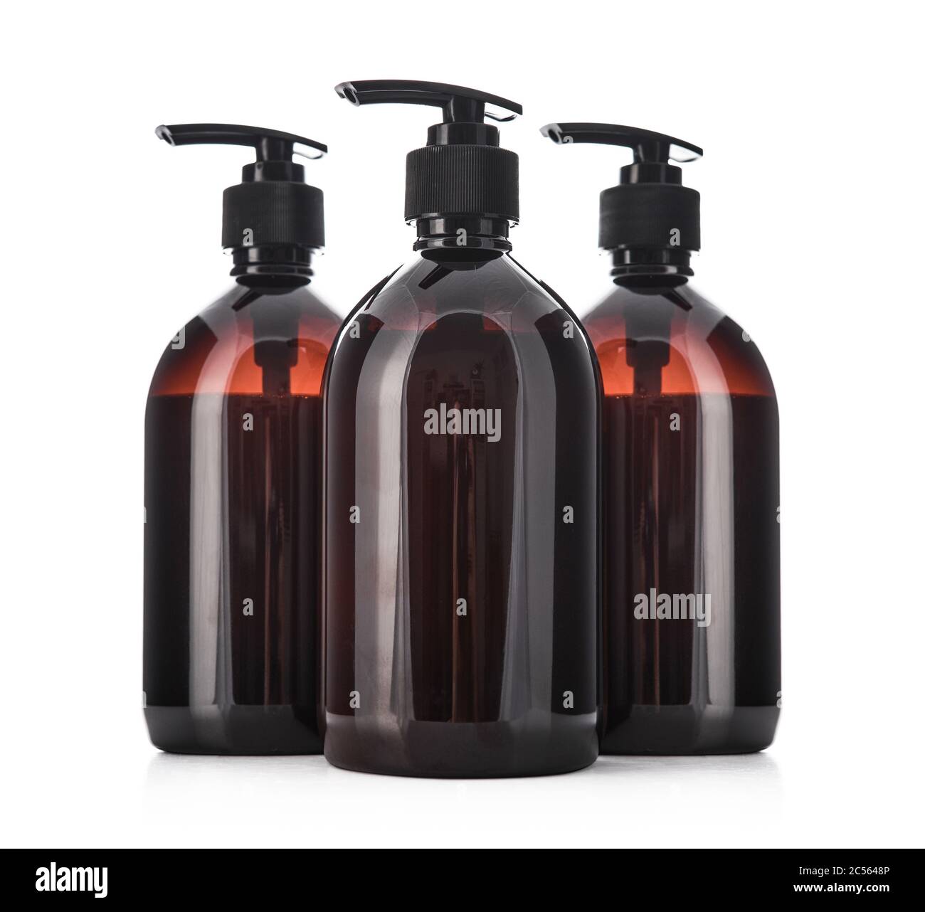 Plastic brown bottles with dispenser pumps isolated on white background ...