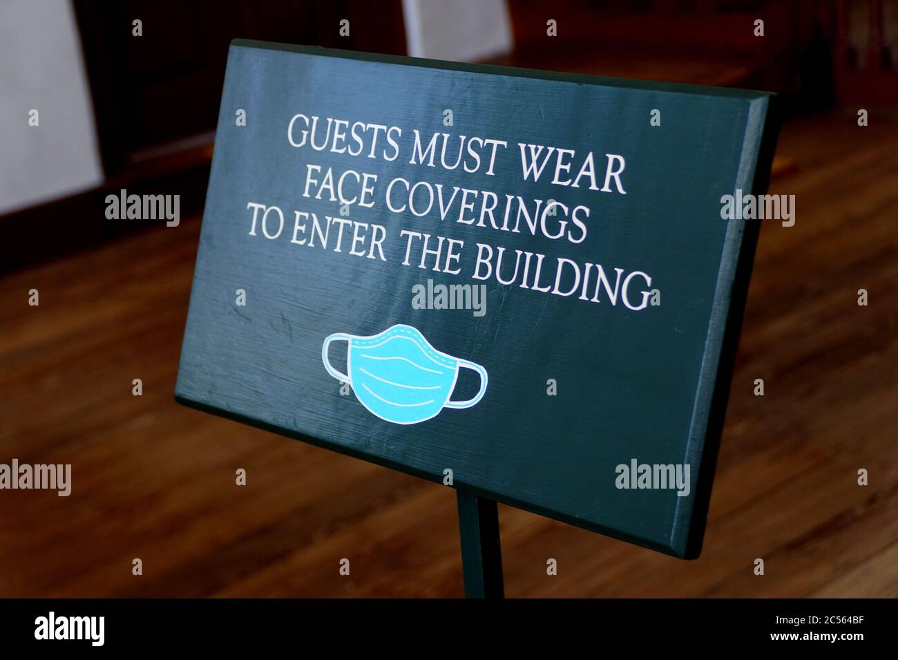 Williamsburg, Virginia, U.S.A - June 30, 2020 - The door sign asking ...