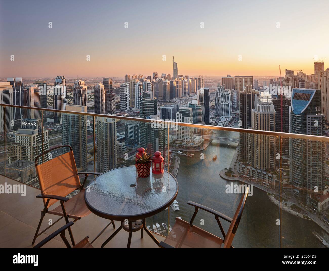 View from an apartment over the Dubai Marina, table with chairs ...