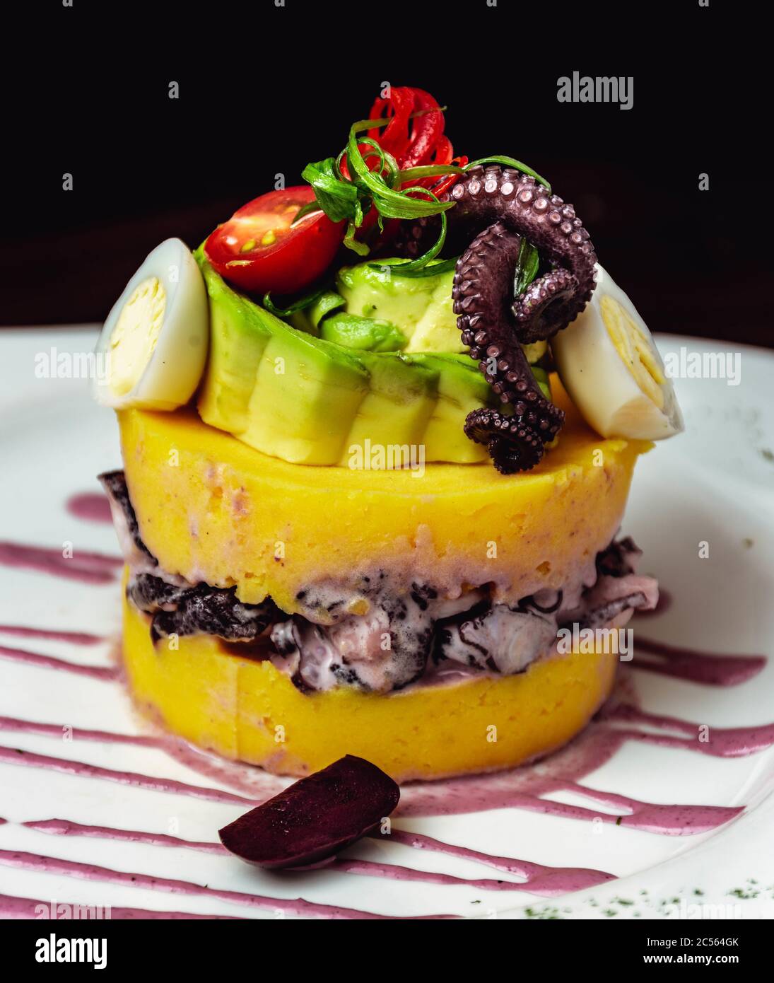 Mashed potato stuffed with Octopus tentacles and avocado Stock Photo ...