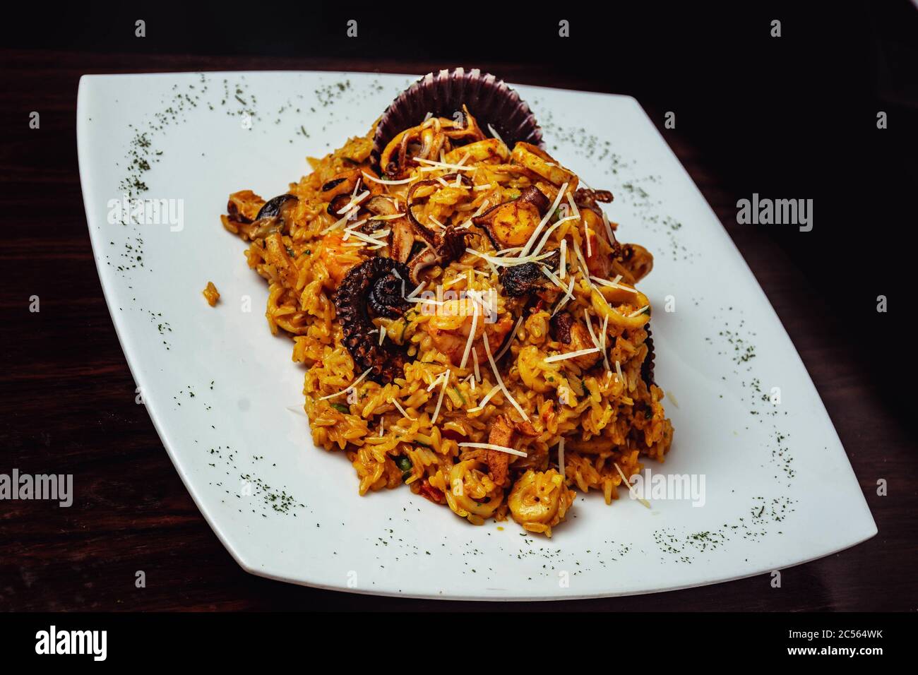 Fried rice with grilled octopus tentacles Stock Photo - Alamy