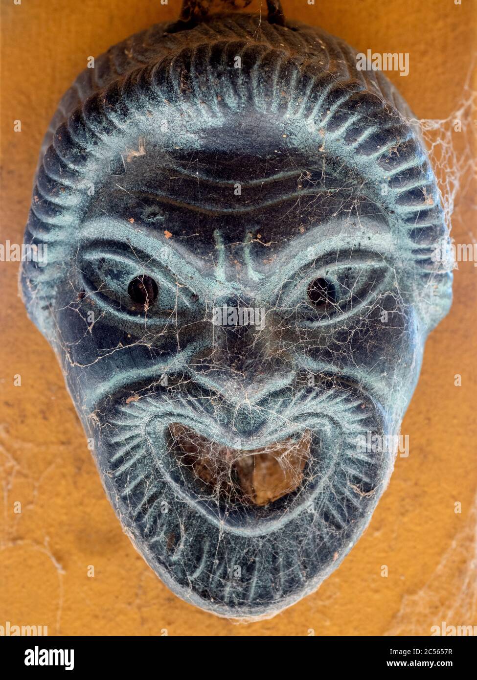 Cobweb covered mask Stock Photo - Alamy