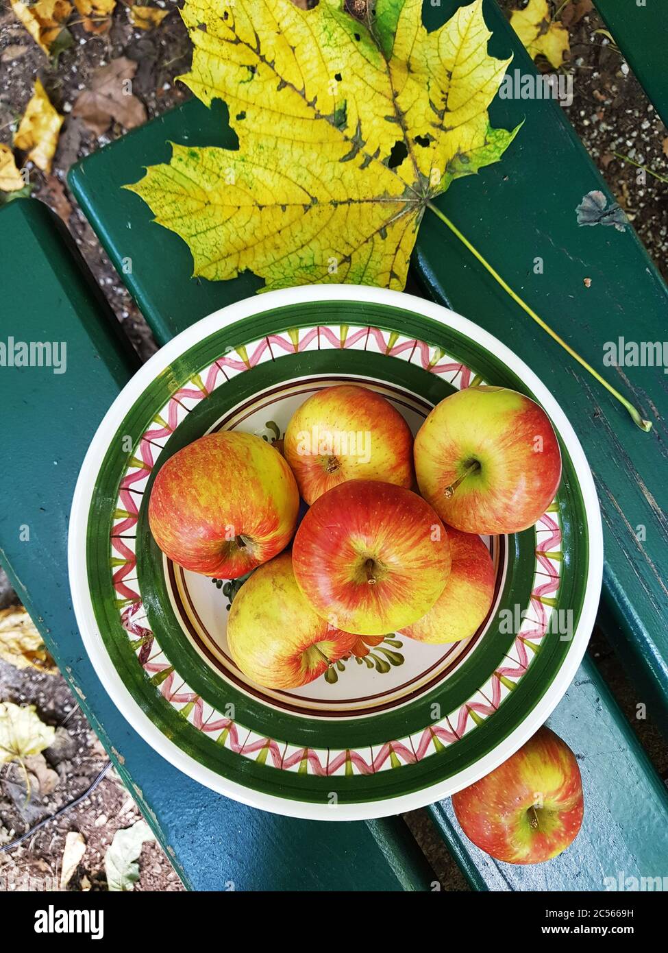 Plate of apples on bench Stock Photo - Alamy