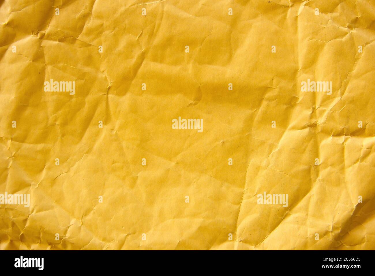 Crumpled yellow paper texture for a background Stock Photo - Alamy
