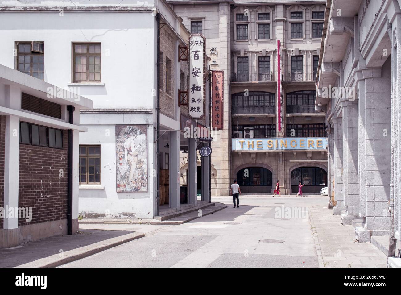 Tourists walk around the set of a Chinese period drama. Actors and ...
