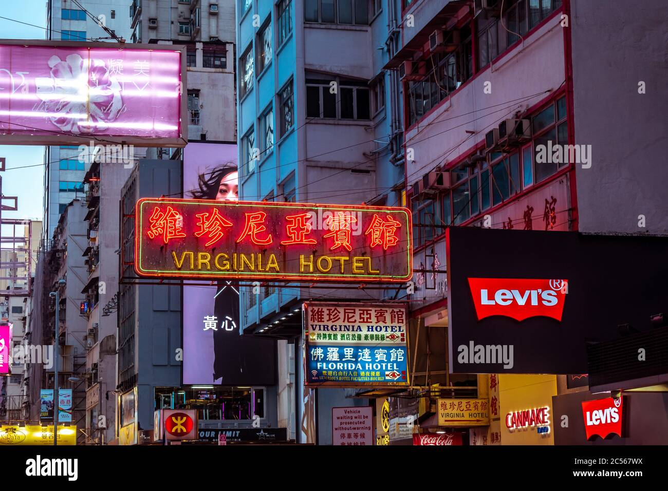 Hong Kong / China - November 11 2018: Neon storefront signs illuminate ...
