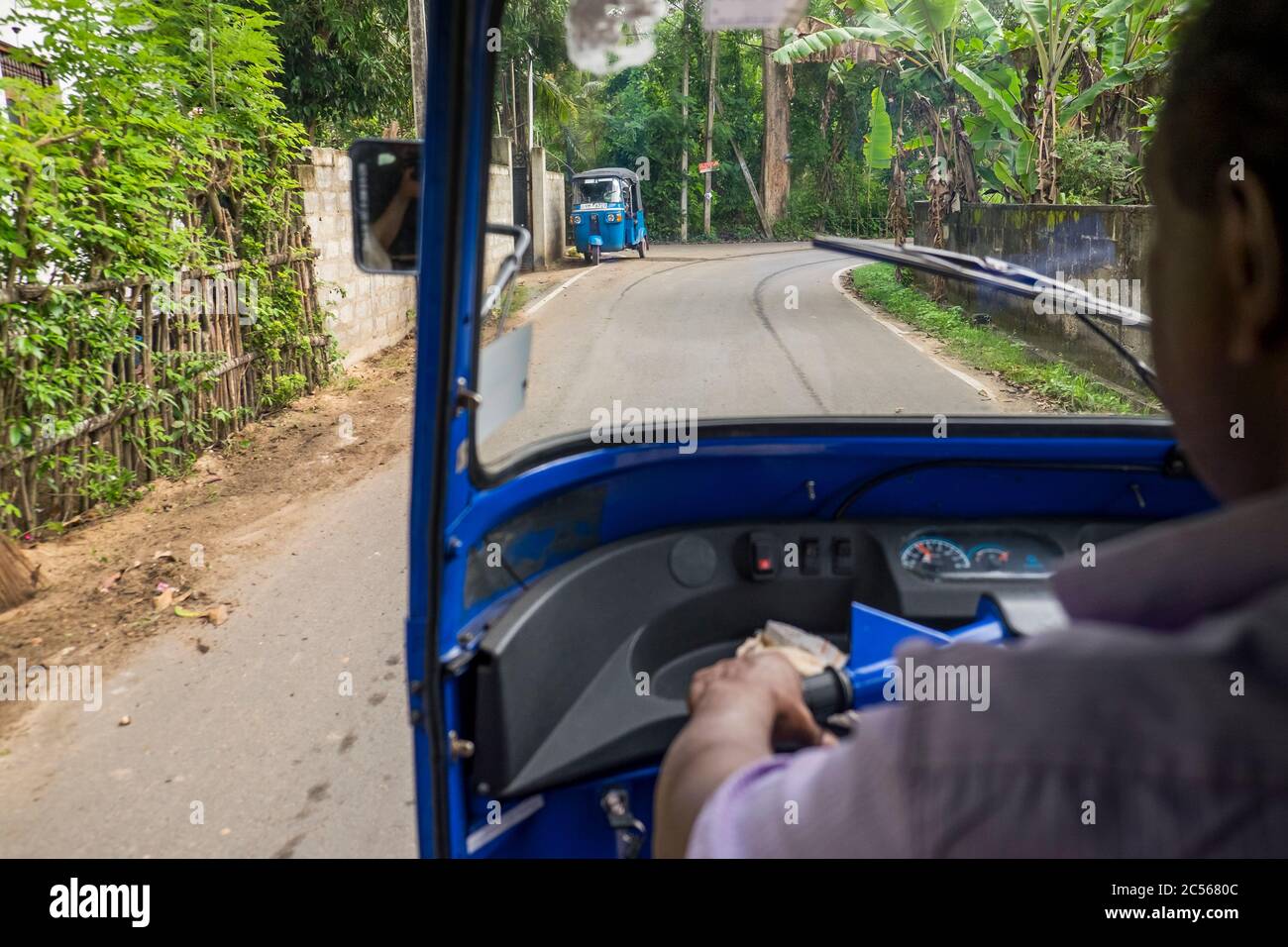 Looking over the shoulder of a TukTuk driver, Sri Lanka Stock Photo - Alamy