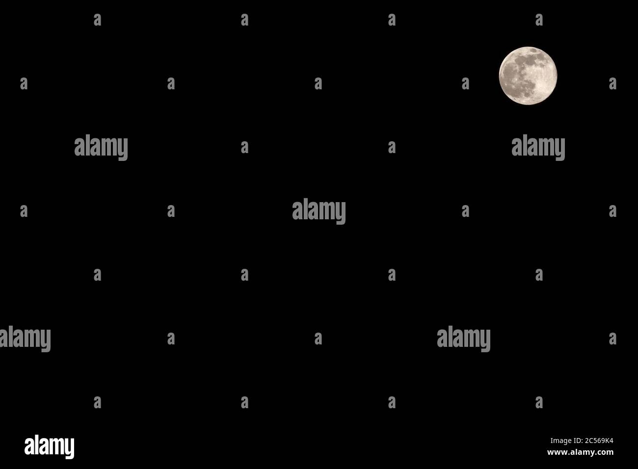 Isolated shot of the moon in the distance during a dark night Stock ...