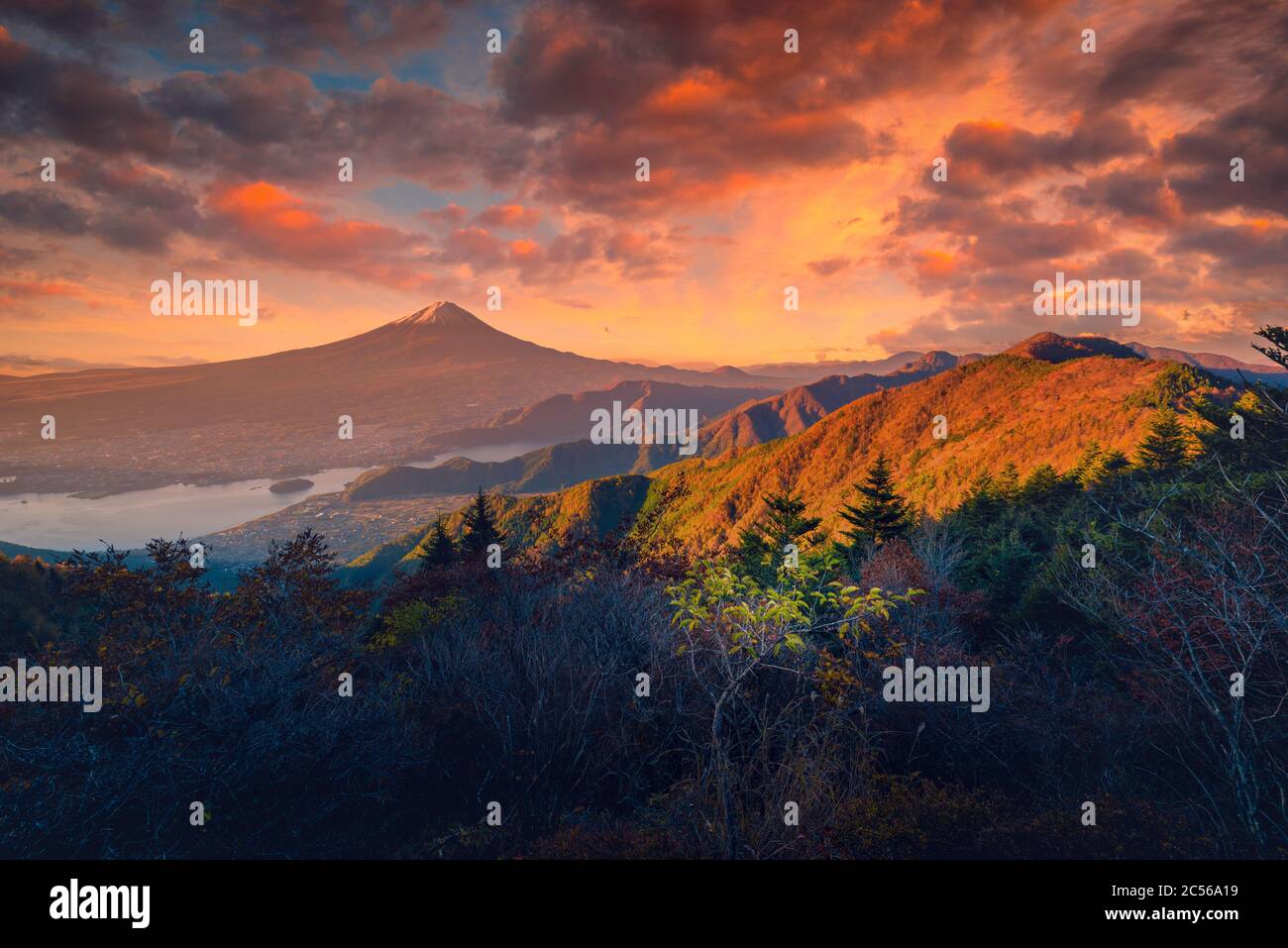 Landscape image of Mt. Fuji over Lake Kawaguchiko with autumn foliage at sunrise in ...