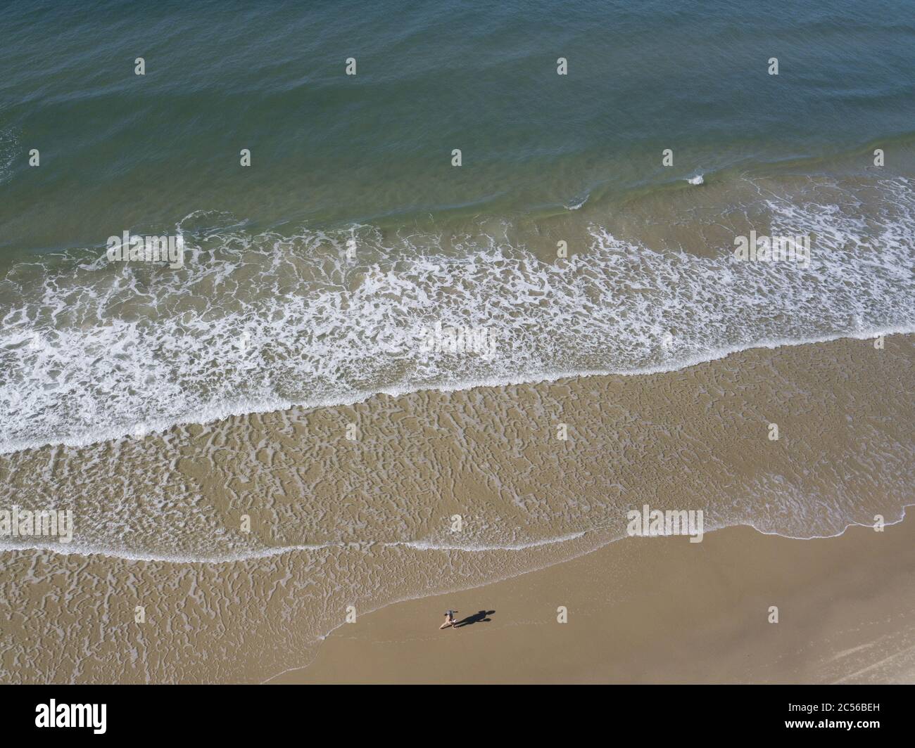 Pure calm water of the sea approaching the sand at the beach Stock ...