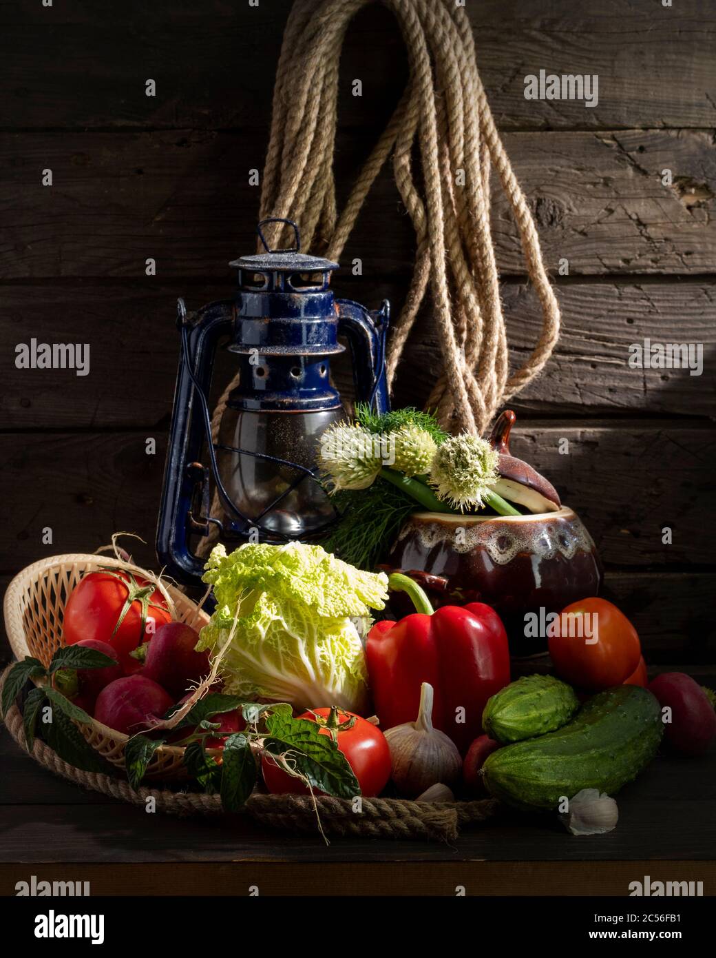Still life with fresh vegetables on wooden background in rustic style ...