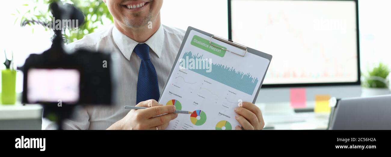 Smiling vlogger in office Stock Photo - Alamy