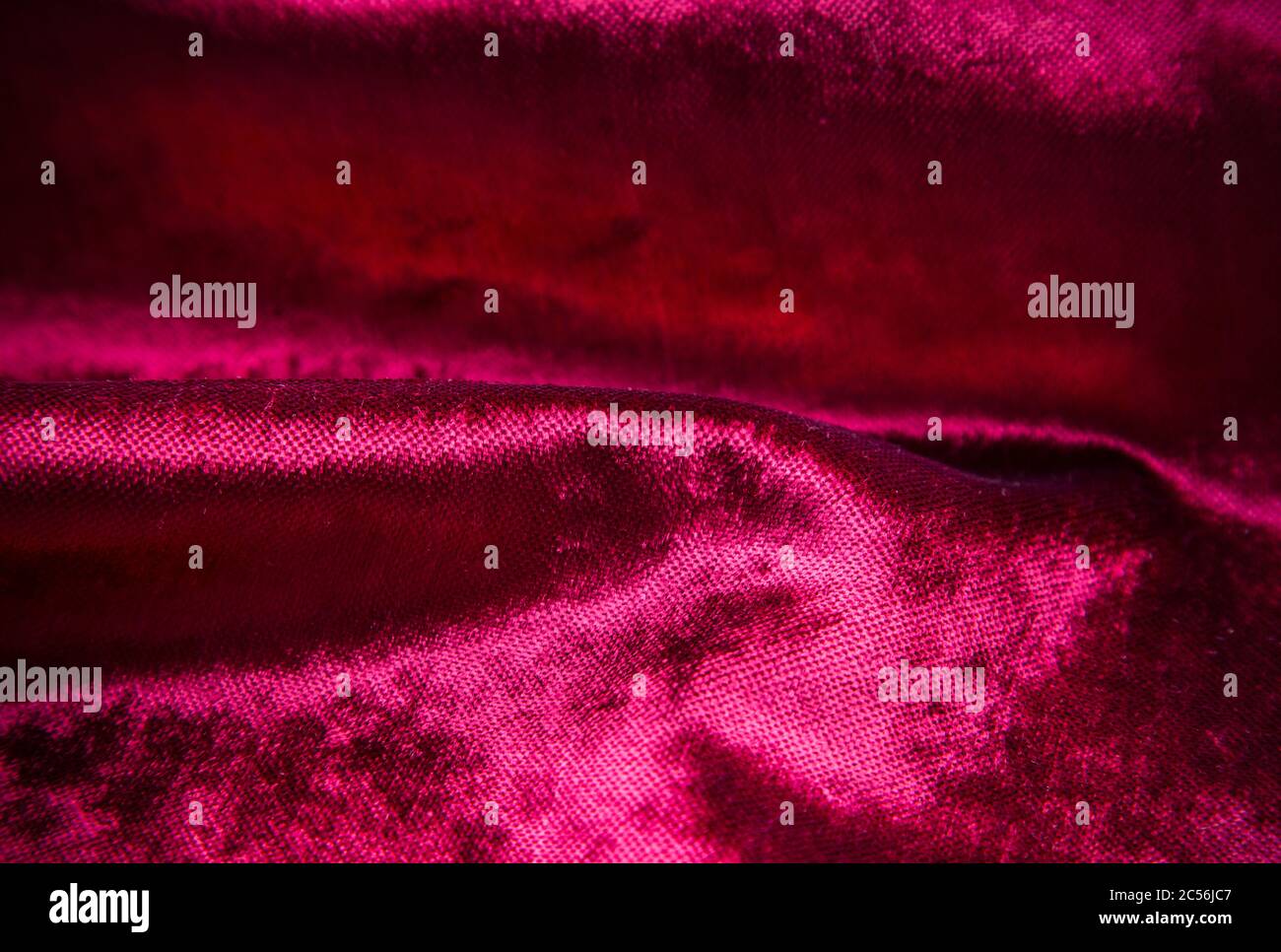 Abstract red violet velvet fabric background texture Stock Photo - Alamy