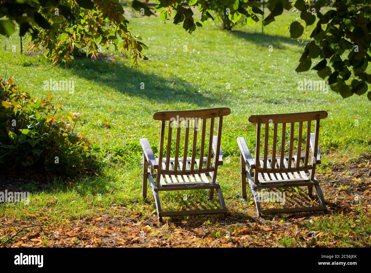 Two wooden reclining chairs hi-res stock photography and images - Alamy