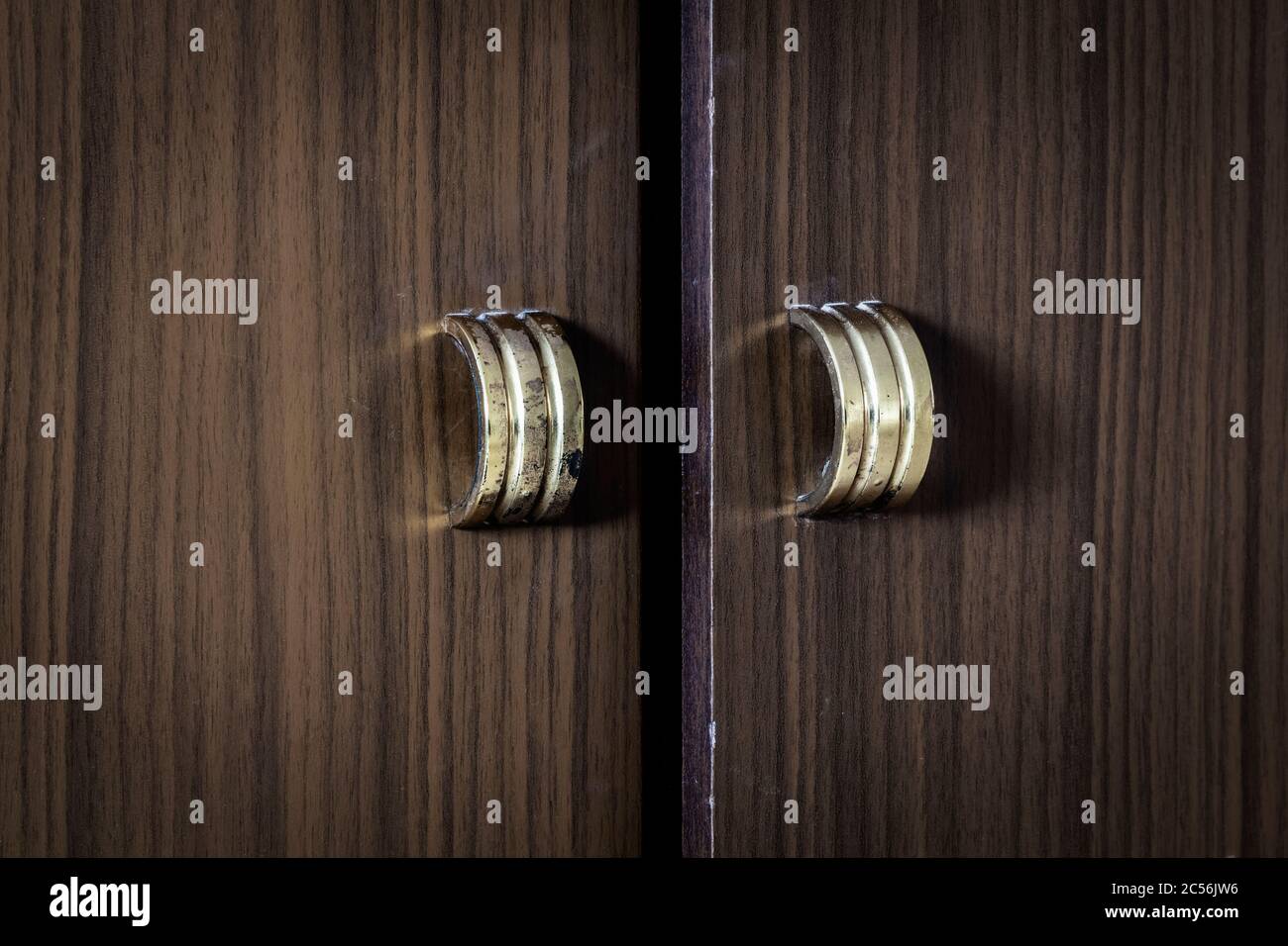 The old mysterious closet in the attic is ajar Stock Photo - Alamy