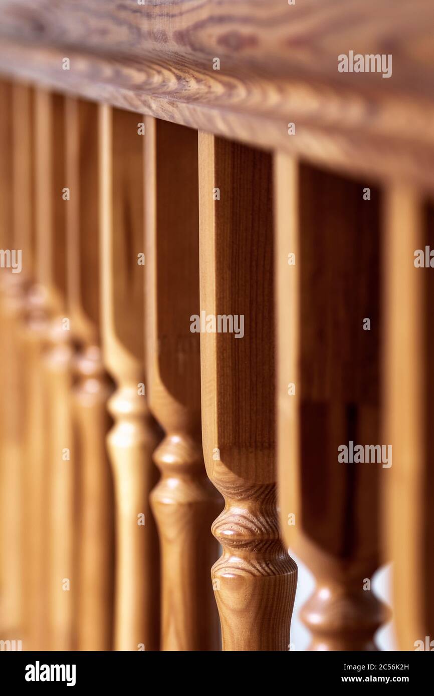 Element of a wooden interior staircase. Wooden baluster close-up Stock ...