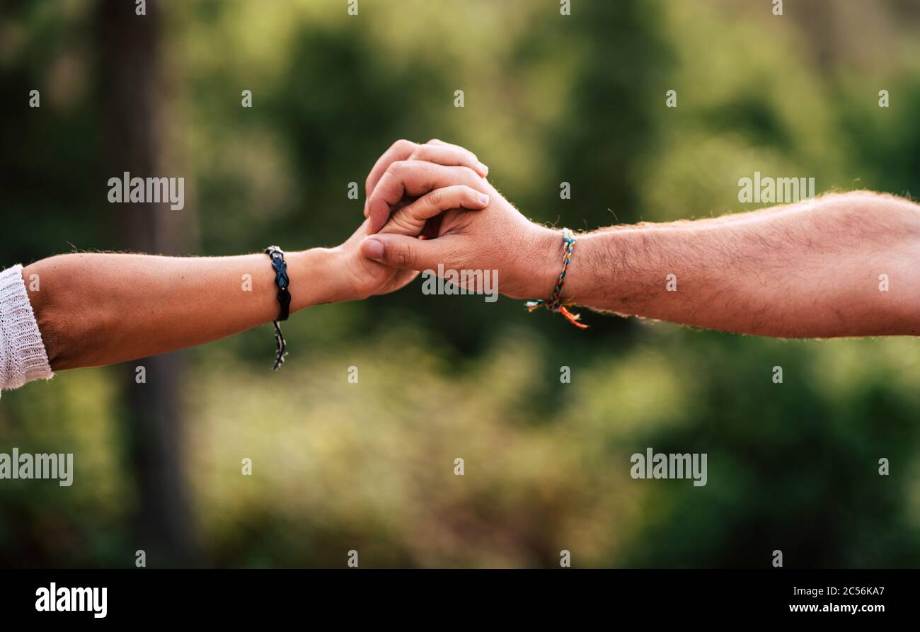 Love and team concept with woman and man hands holding together - help ...