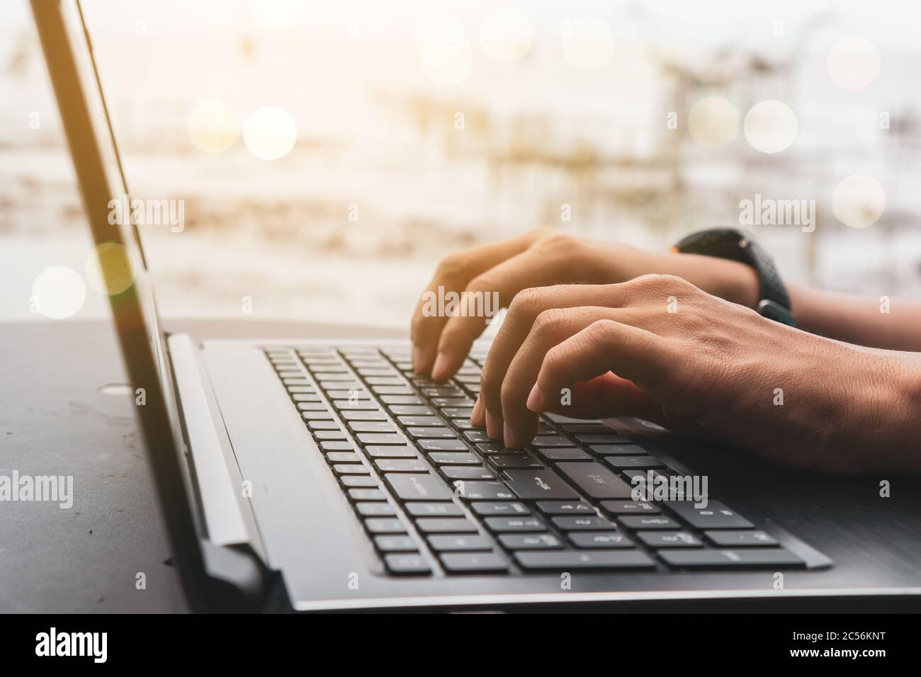 Woman hand using laptop to work study on work desk with clean nature ...