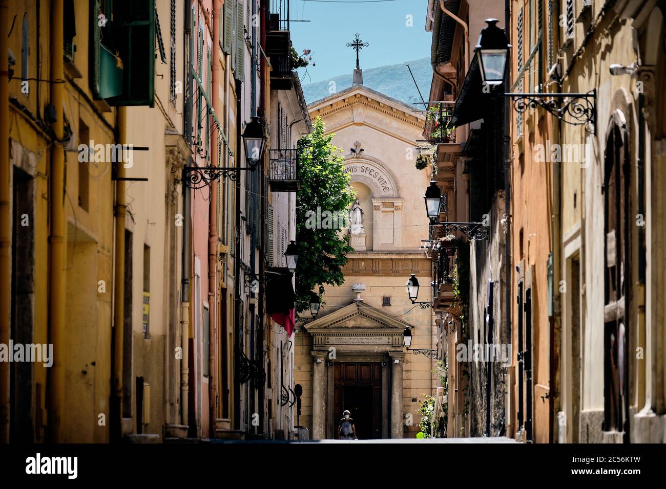 Horizontal shot of a rural neighborhood street on a sunny day in Menton ...