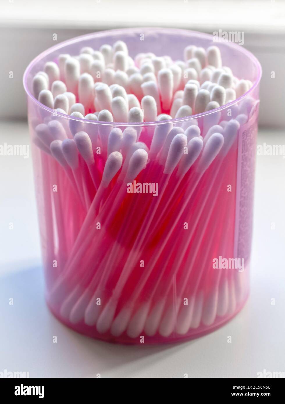 Red ear sticks in open plastic packaging close-up Stock Photo - Alamy