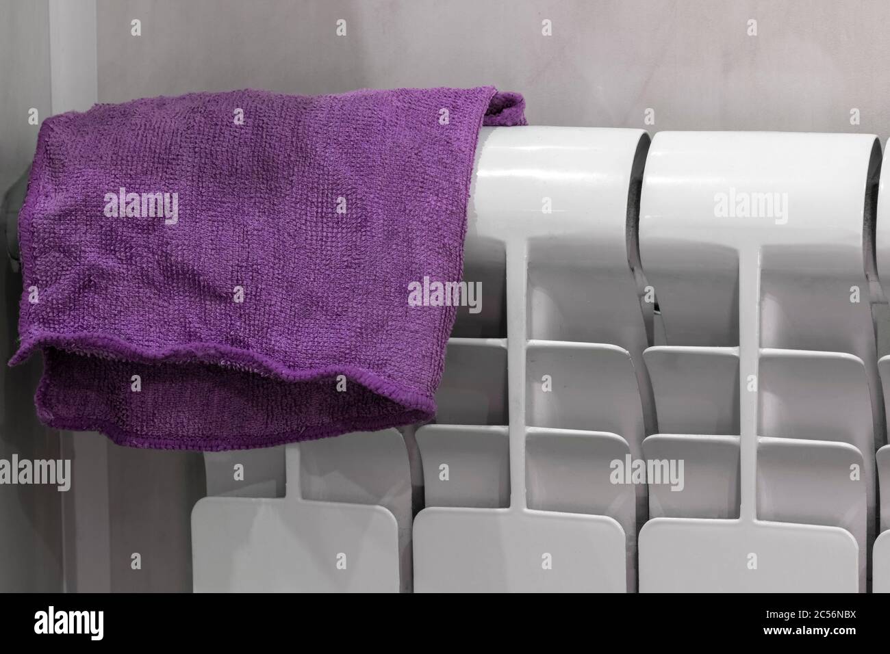 The rag is dried on the heating battery close-up Stock Photo - Alamy