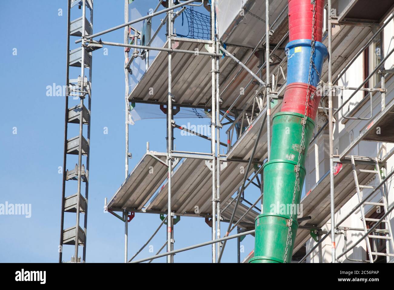 Construction site, downpipe for building rubble on the facade of a ...