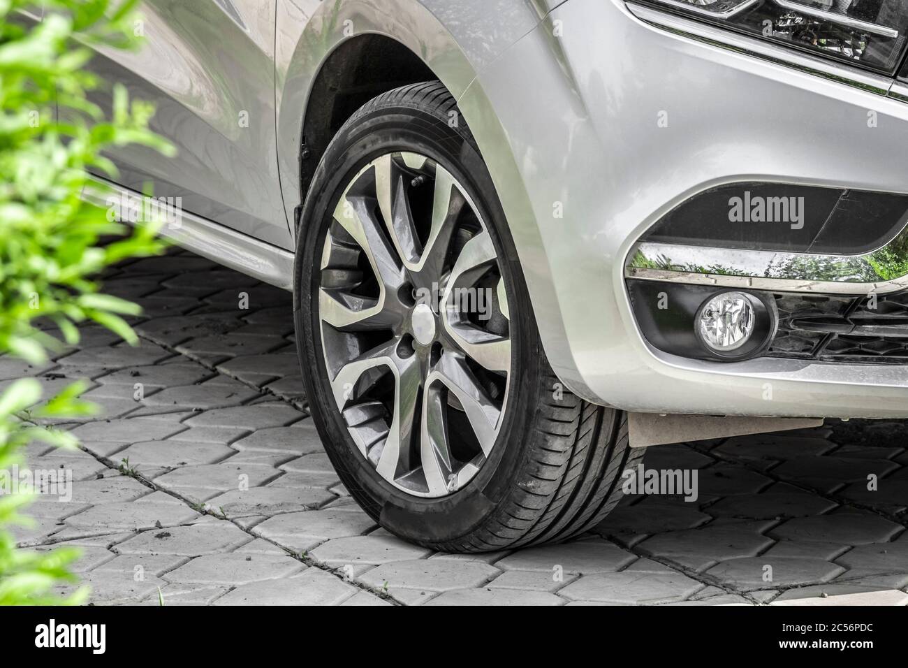 Tread of a wheel of car standing in the back yard, closeup Stock Photo ...
