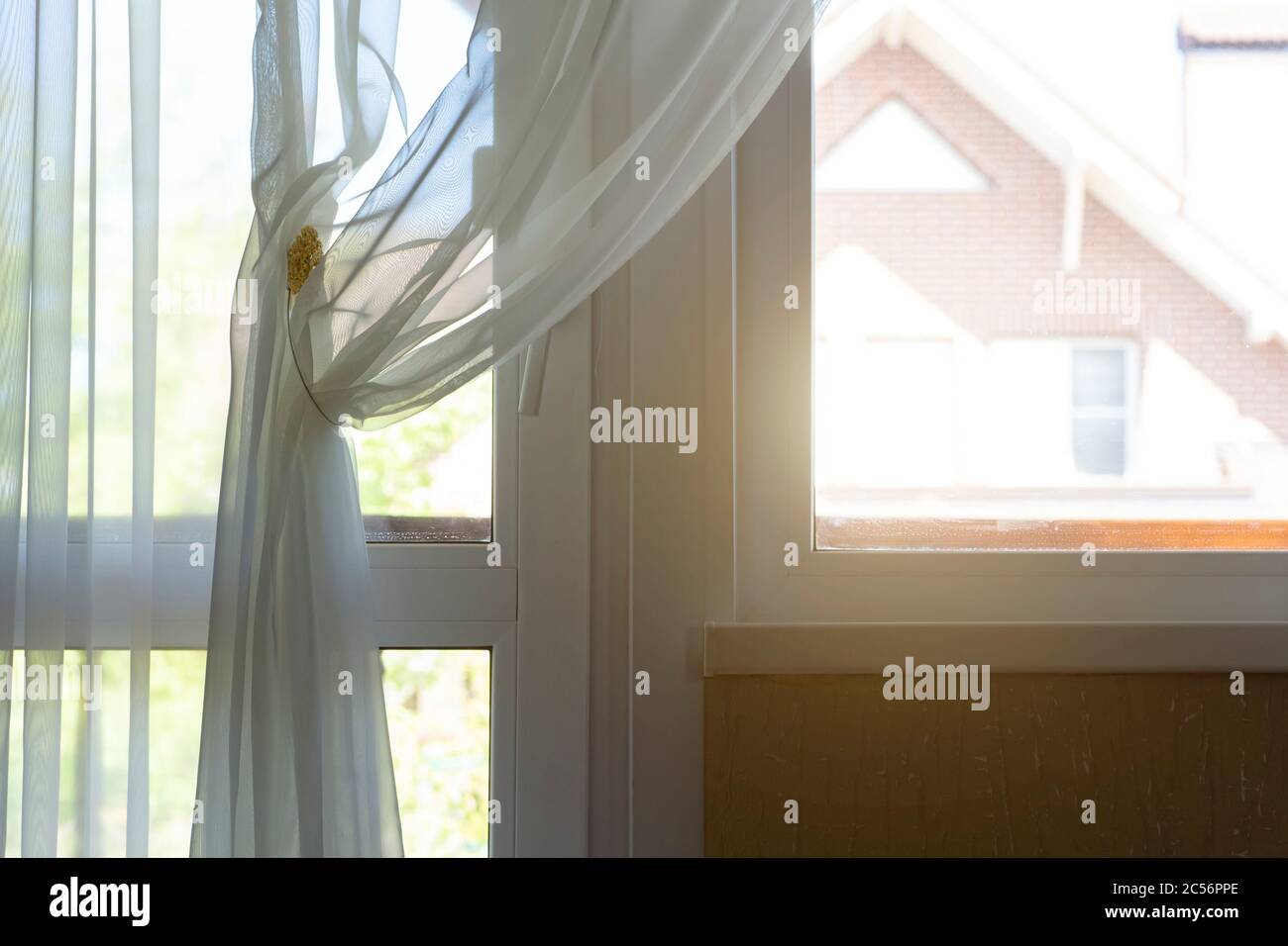 View of a wide window with curtains during a sunset Stock Photo - Alamy