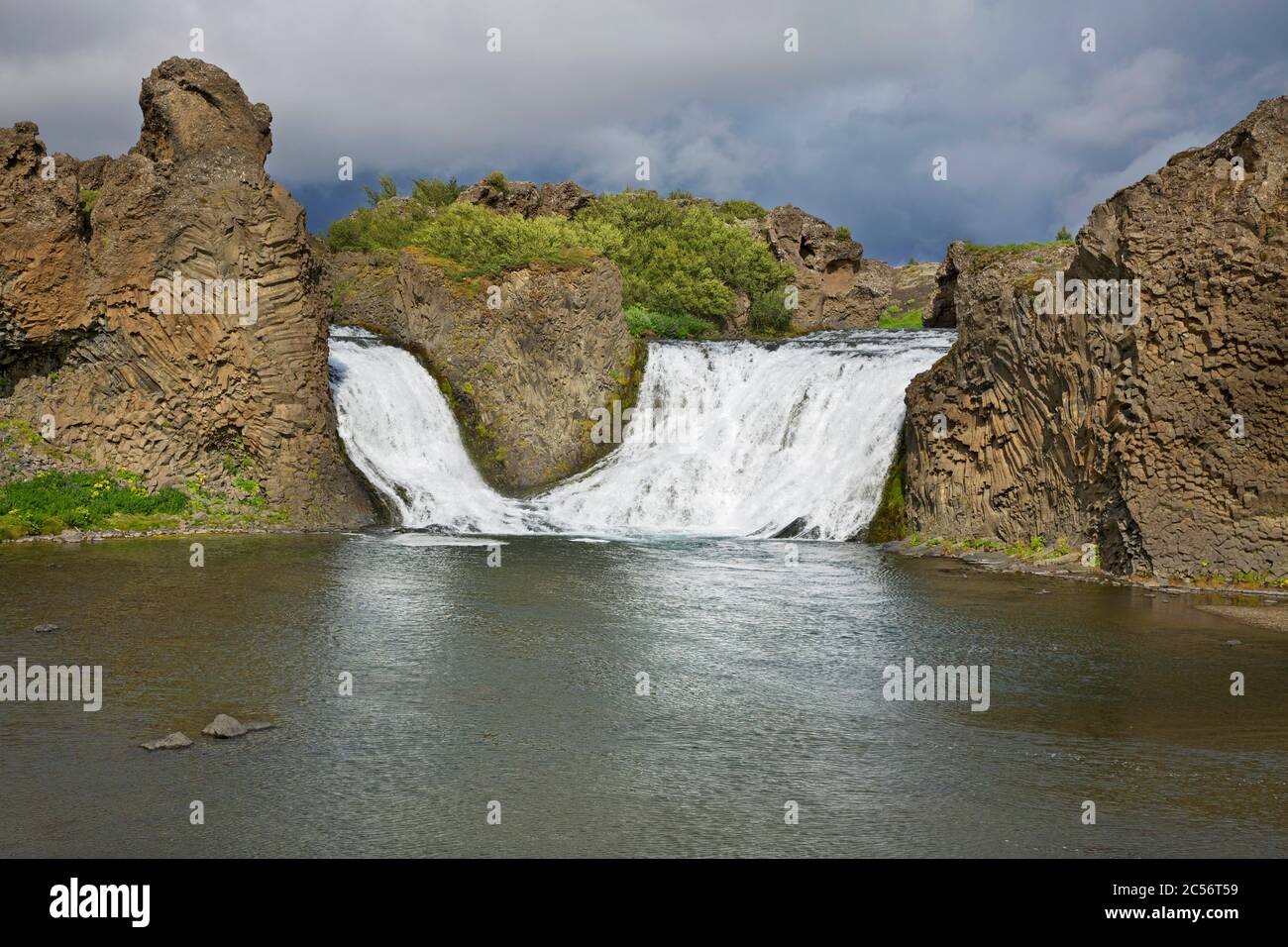 The river Fossa falls in Hjalparfoss in a double waterfall into a wide ...