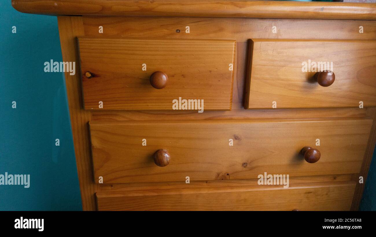Old-style wooden brown drawer with wooden handles Stock Photo - Alamy