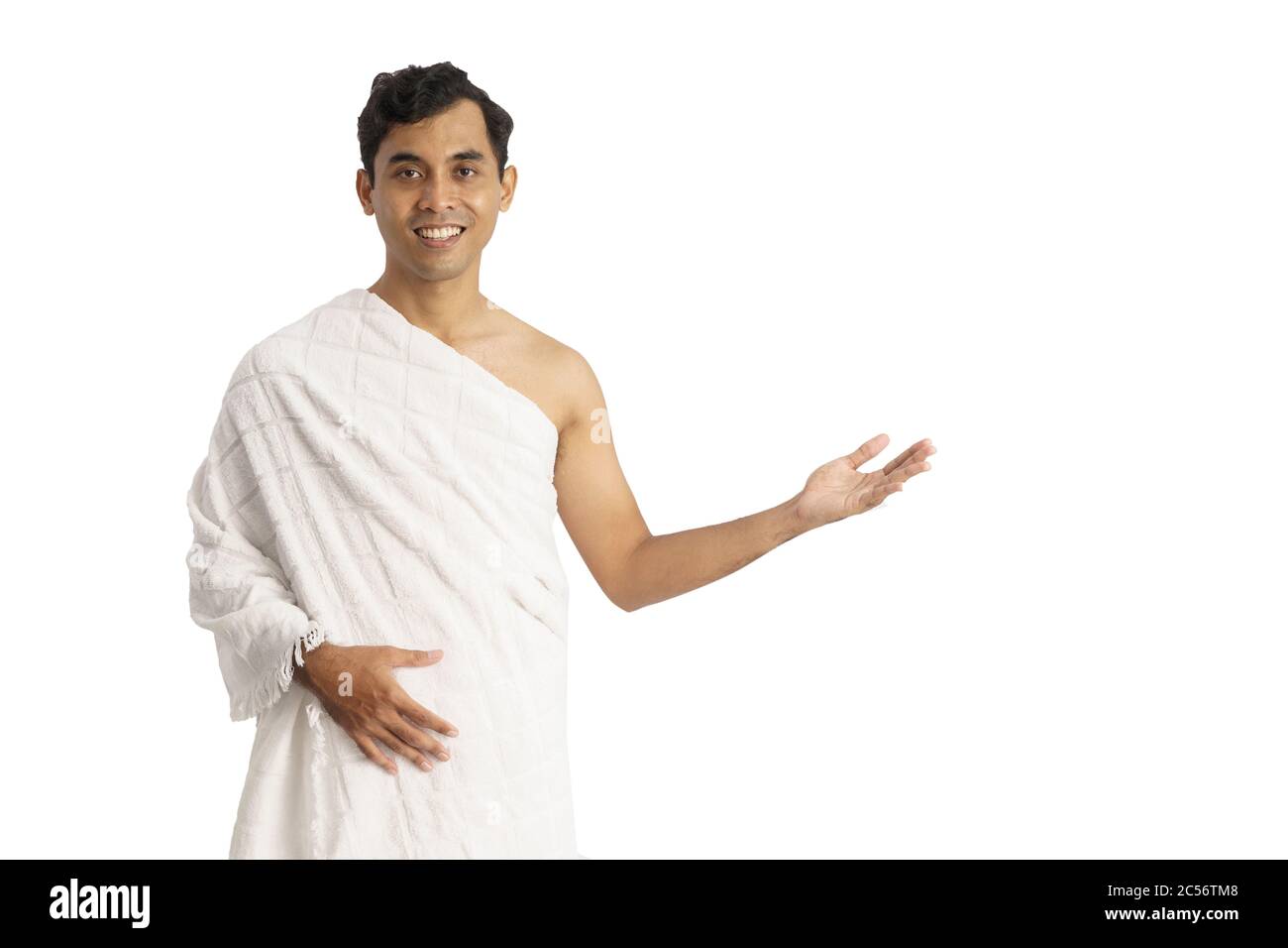asian male with ihram presenting copyspace. hajj and umrah man concept ...