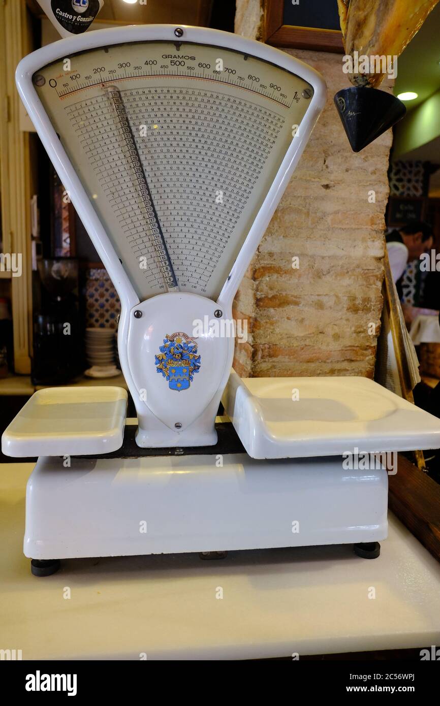 Vertical picture of a vintage scale in a market Stock Photo - Alamy