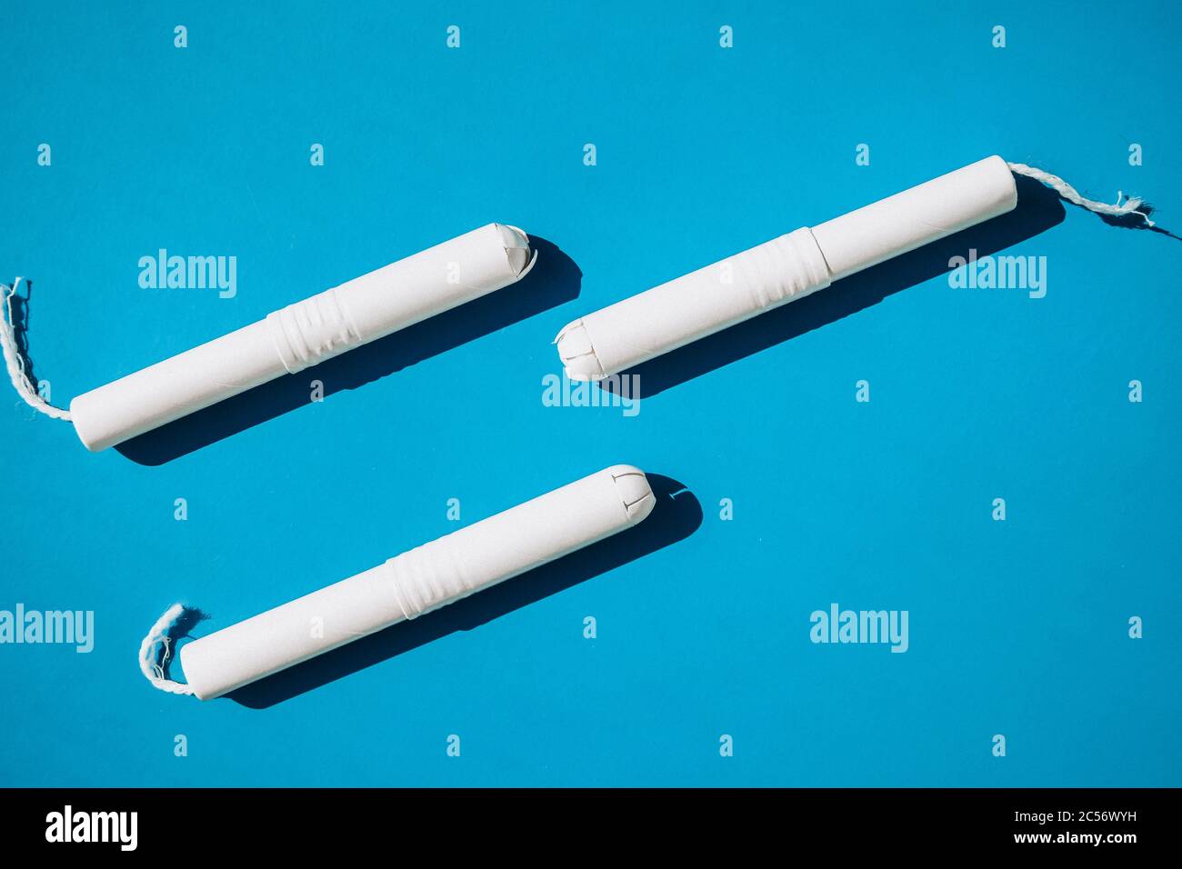 Hygienic tampons on a blue and purple background. copy space ...