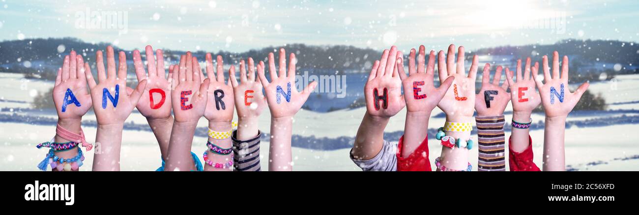 Kids Hands Holding Word Anderen Helfen Means Help Others, Winter ...