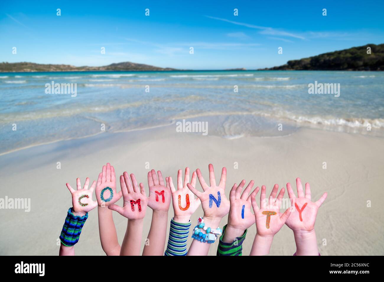 Children Hands Building Word Community, Ocean Background Stock Photo ...