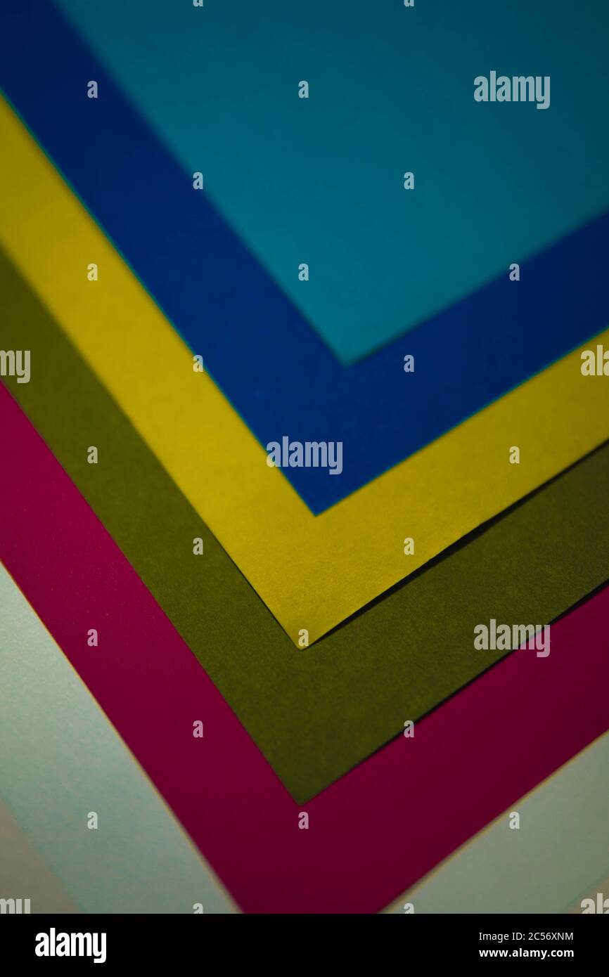 Colorful papers on a desk Stock Photo - Alamy